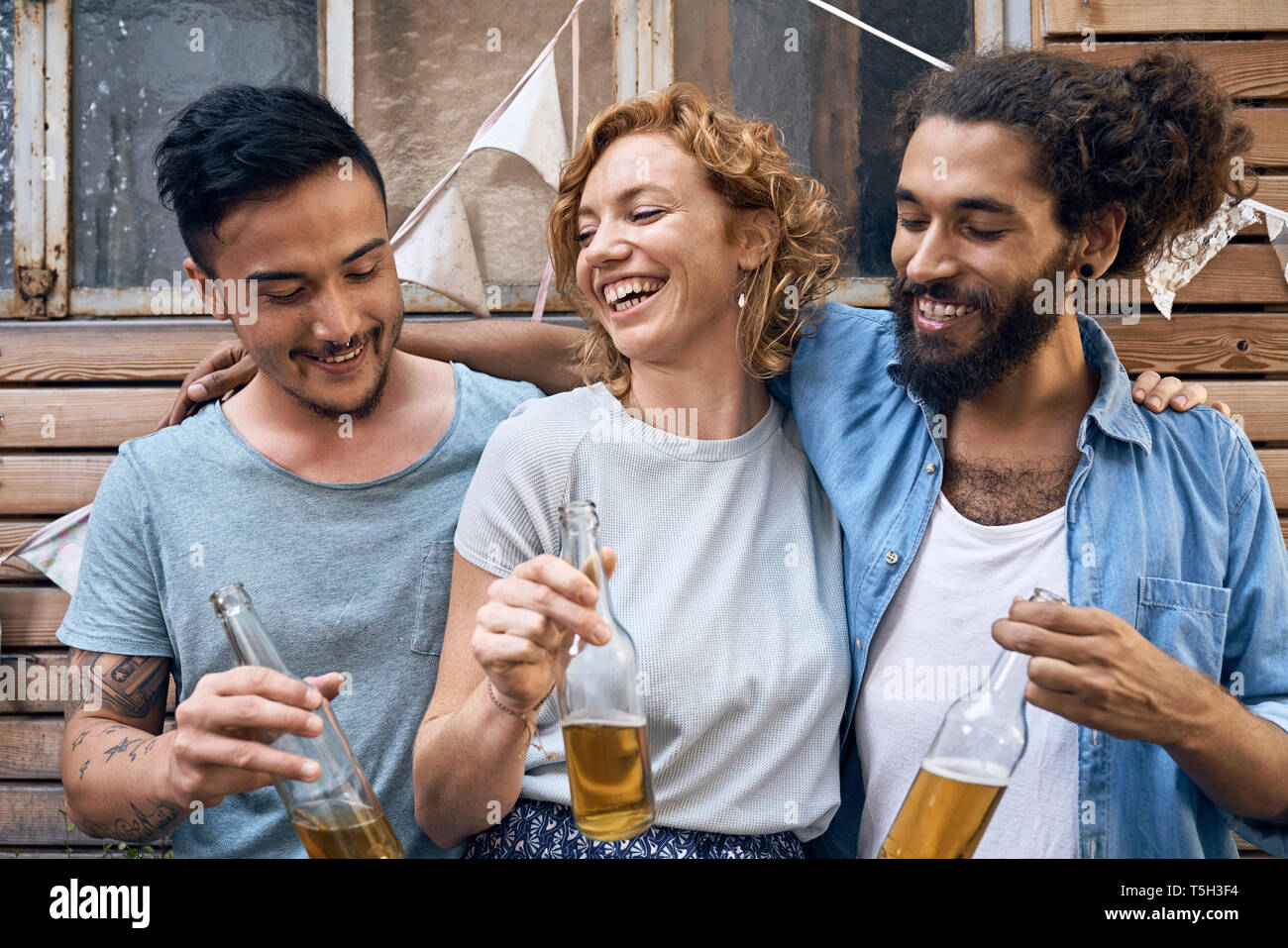Freinds having fun at a barbecue party, drinking beer Stock Photo - Alamy