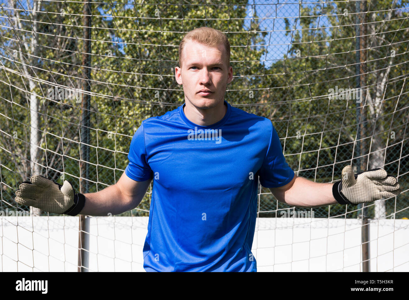 Portrait of focused goalkeeper playing in goal Stock Photo - Alamy