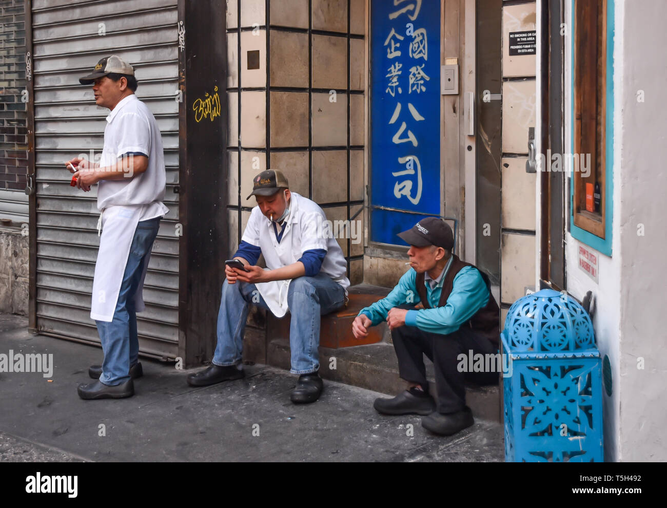 Smoke break in Chinatown Stock Photo - Alamy