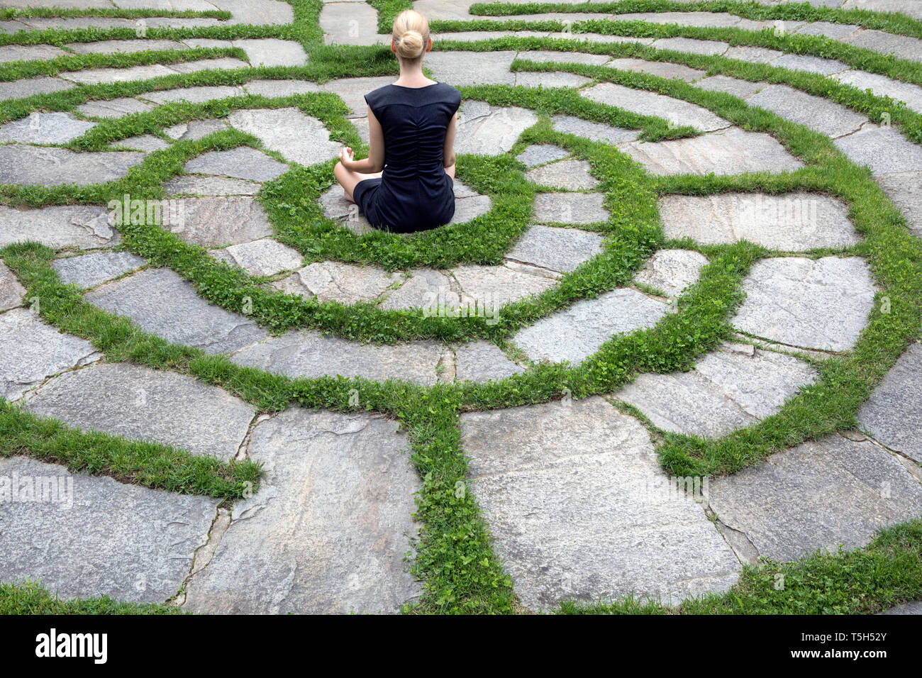 Woman sitting natural open air maze meditating hi-res stock photography ...