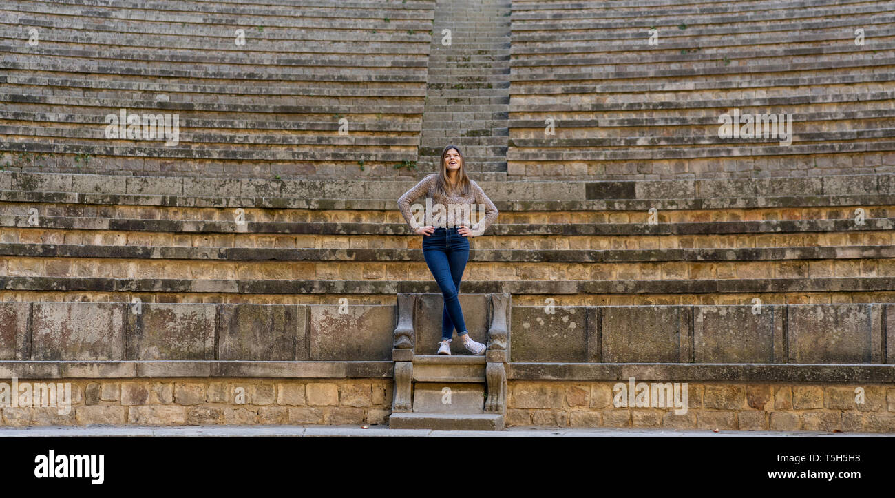 Young woman standing stairs hi-res stock photography and images - Alamy
