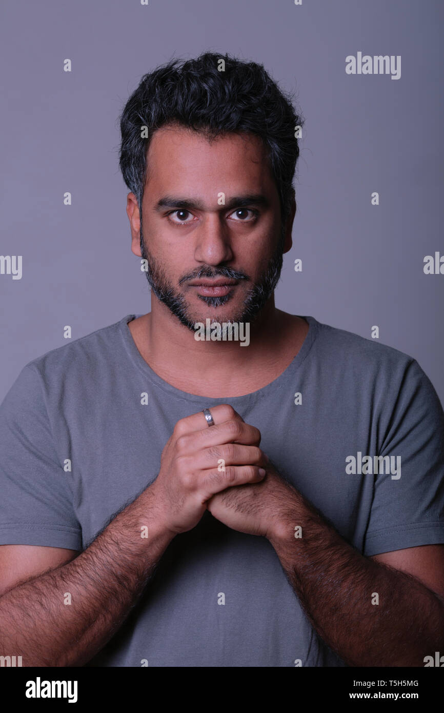 Portrait of an Indian man, looking serious Stock Photo - Alamy