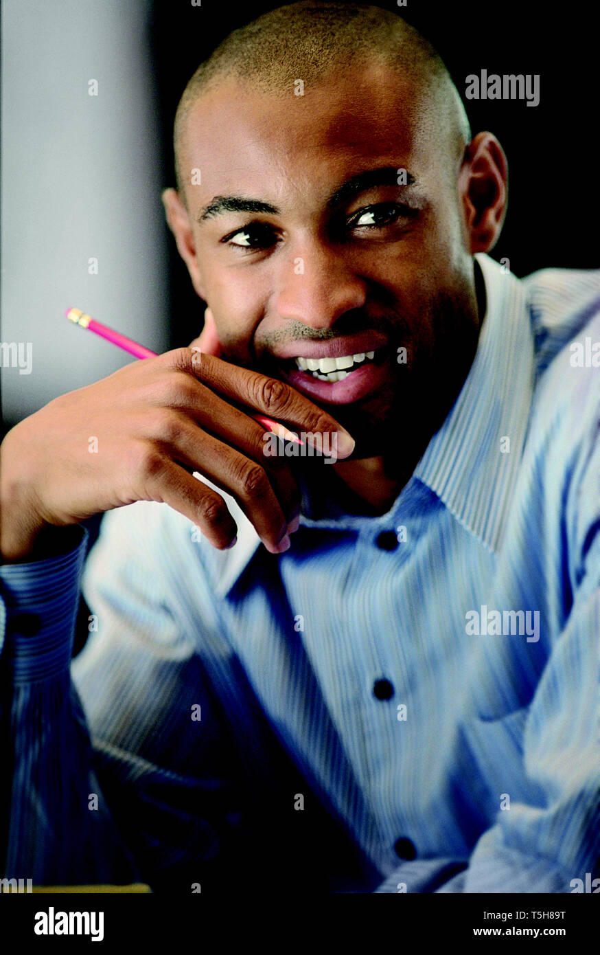Male person holding pencil hi-res stock photography and images - Alamy