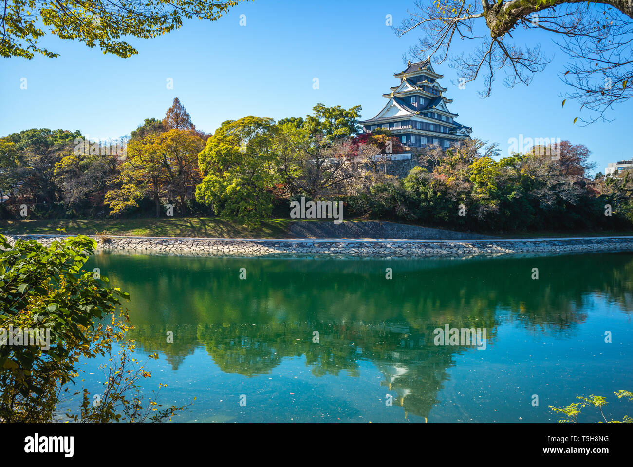 Okayama Castle by river asahi in japan at dusk Stock Photo - Alamy