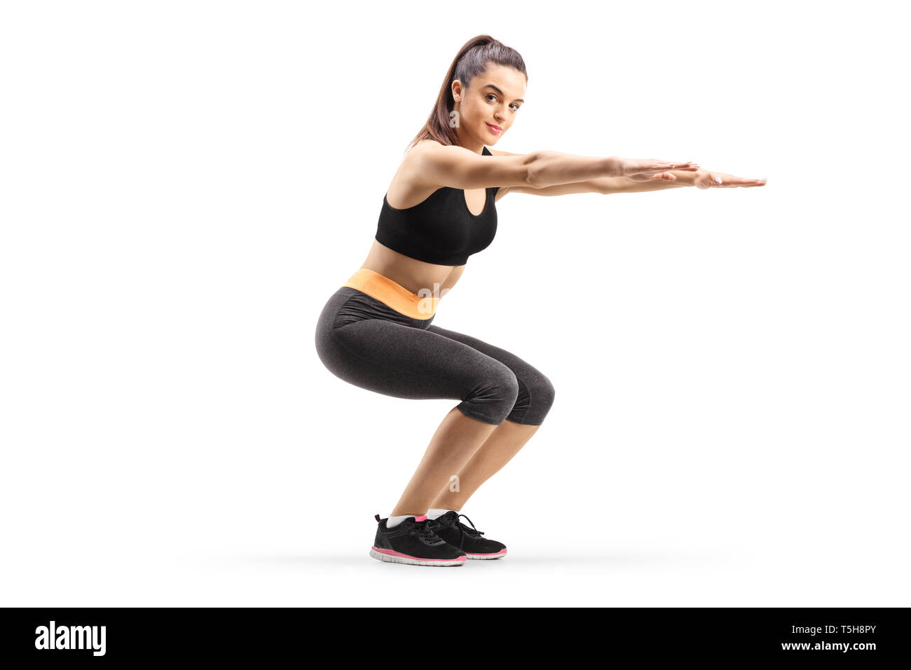 Attractive squatting squat hi-res stock photography and images - Alamy