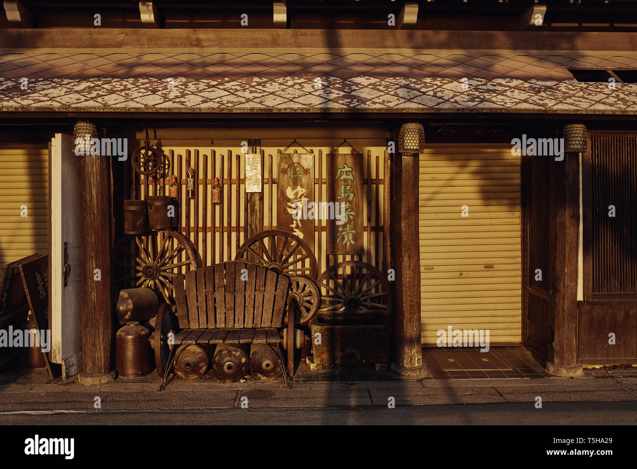 Architectural details of a wooden Japanese building at sunset, in ...