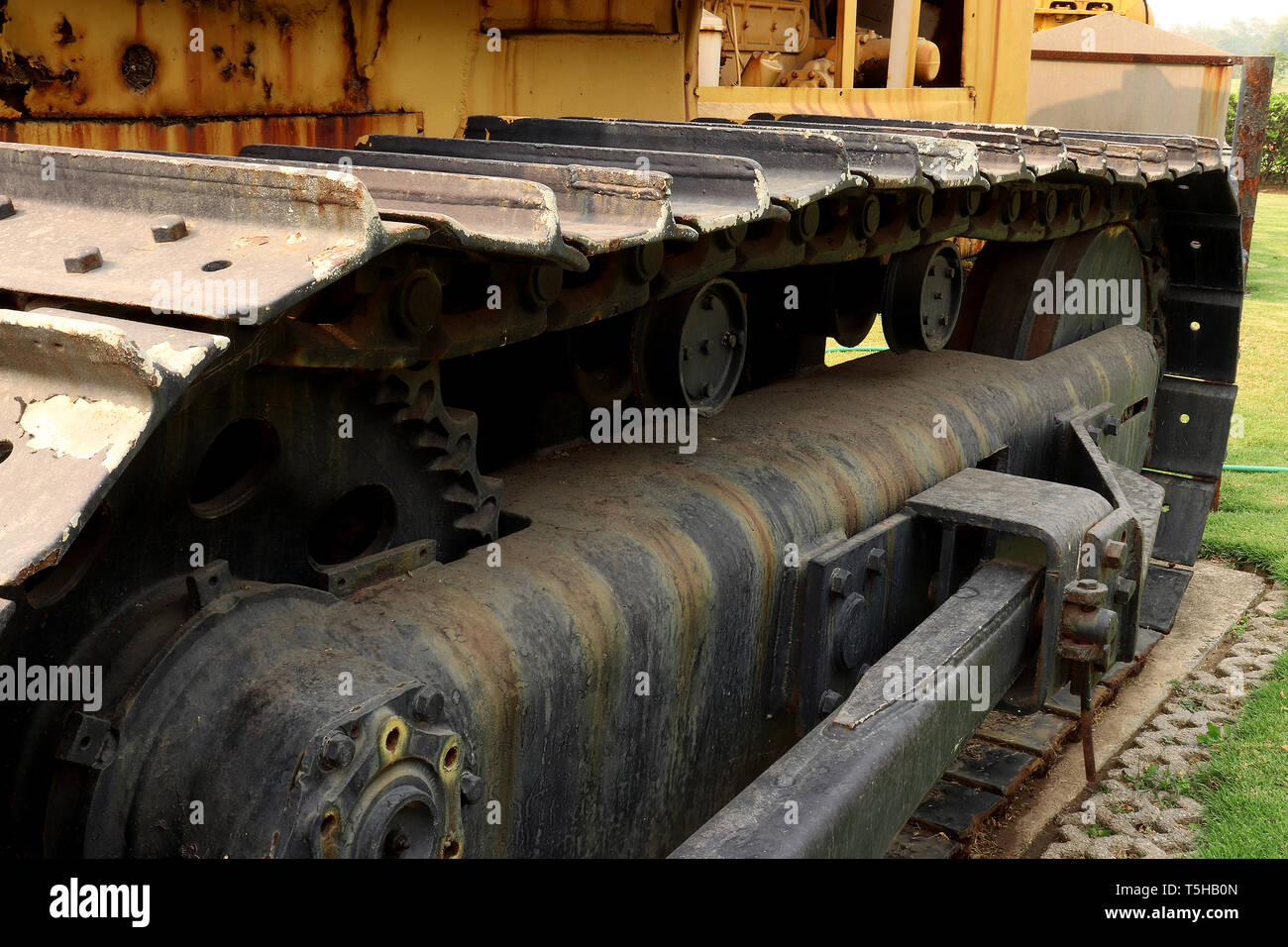 Detail of caterpillar track in construction site with dust - instant ...