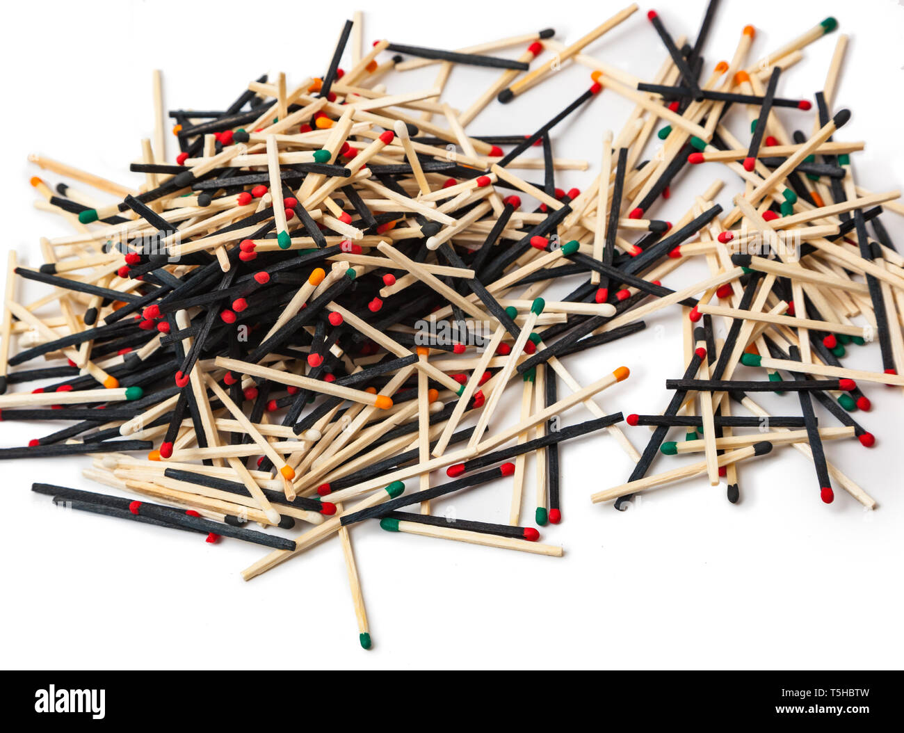 A lot of matches are mixed, of different color, isolated on white ...