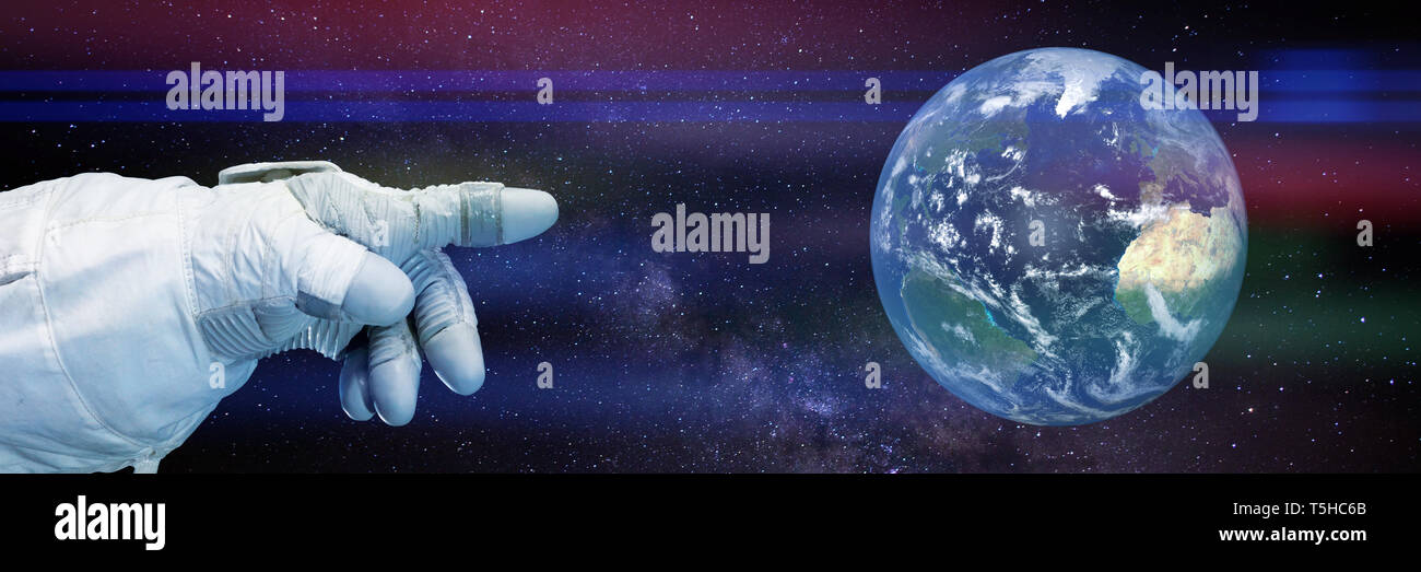 astronaut pointing to planet Earth in front of the Milky Way galaxy ...