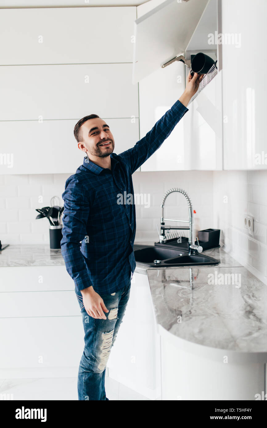 Hand opening kitchen cupboard hi-res stock photography and images - Alamy