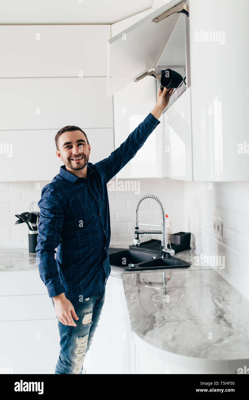 Opening kitchen cabinet door hi-res stock photography and images - Alamy