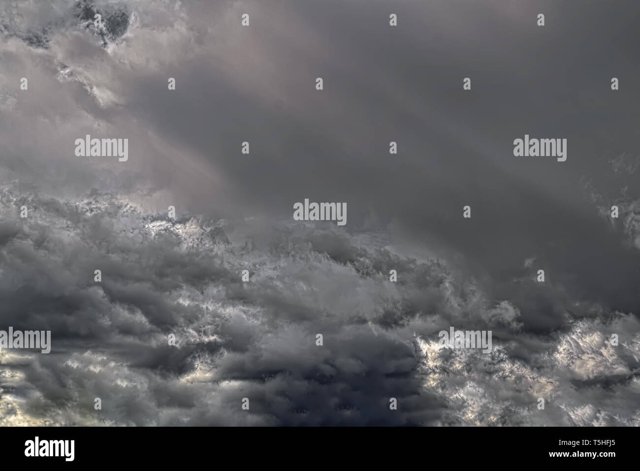 Storm sky covered with dark cumulus clouds before the rain. Dark cloudy ...
