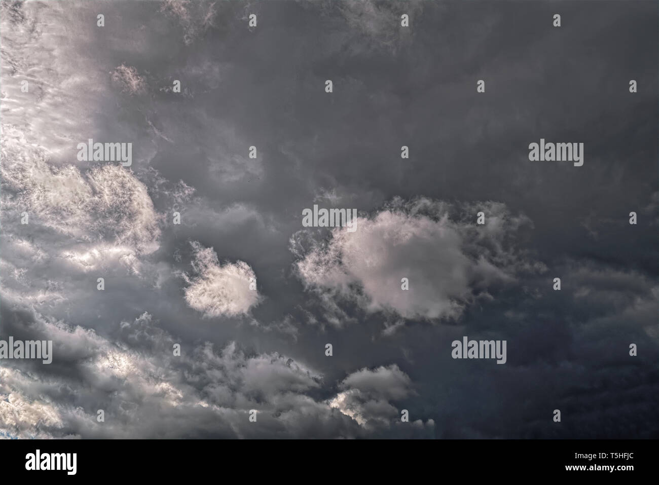 Storm sky covered with dark cumulus clouds before the rain. Dark cloudy ...