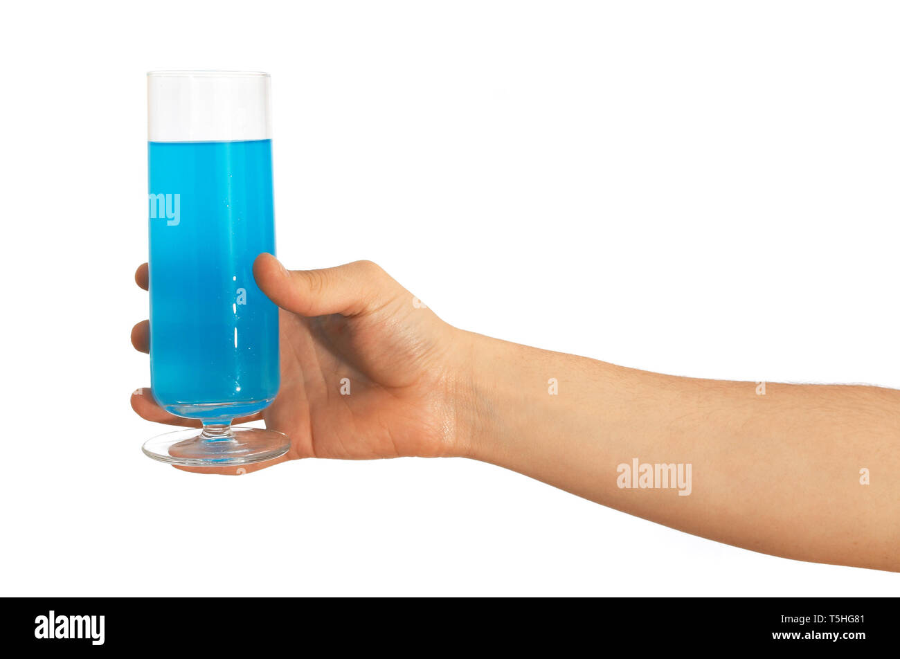 hand holding blue cocktail on white background Stock Photo - Alamy