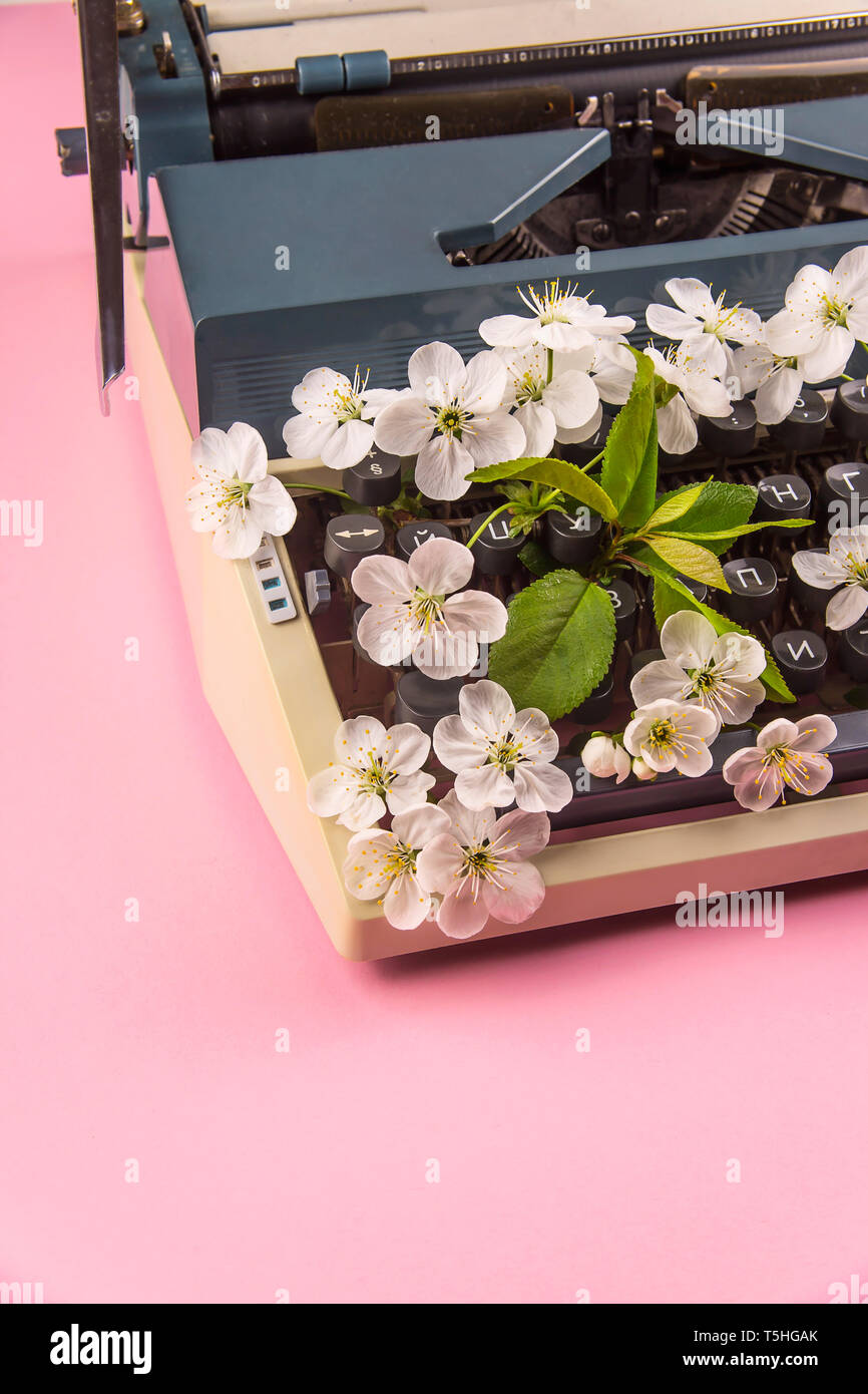 Typewriter with white flowers from the keys - spring writing creativity ...