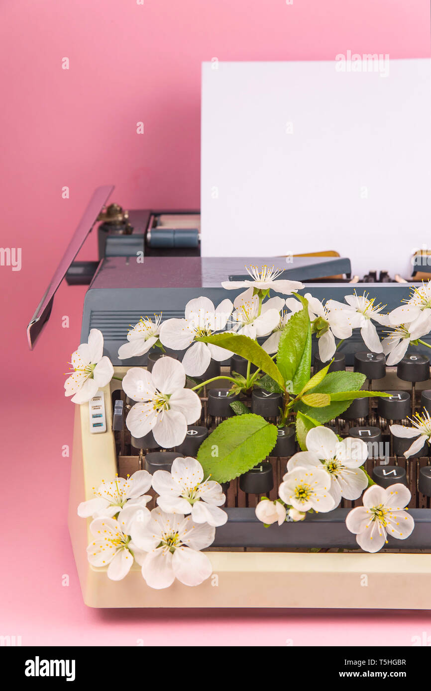 Typewriter with white flowers from the keys - spring writing creativity ...