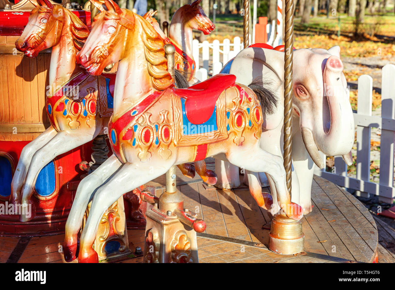 Children outdoor colourful vintage Merry-Go-Round flying horse carousel ...