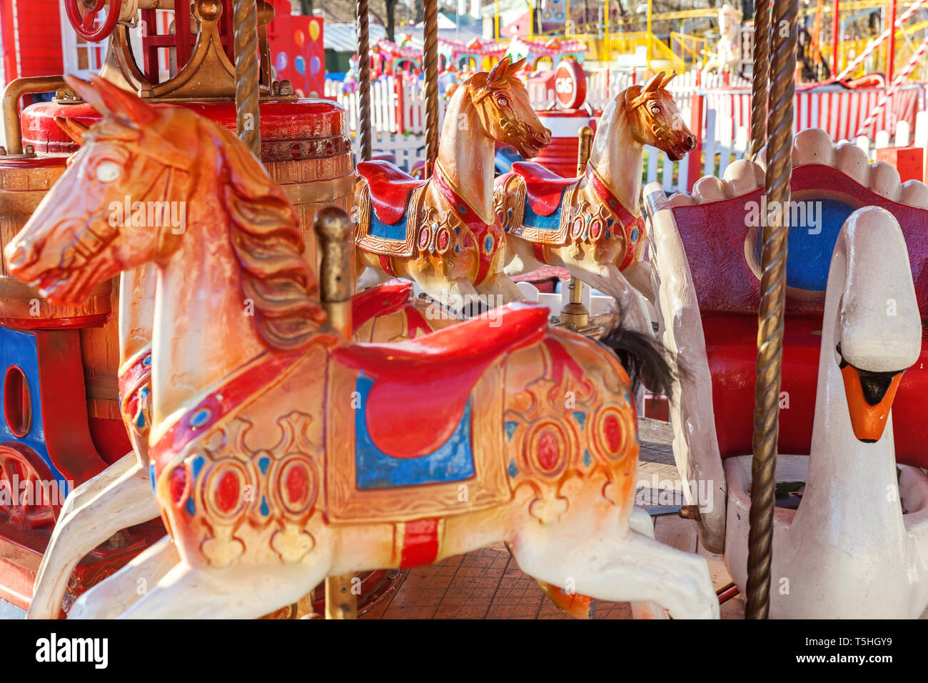 Children outdoor colourful vintage Merry-Go-Round flying horse carousel ...