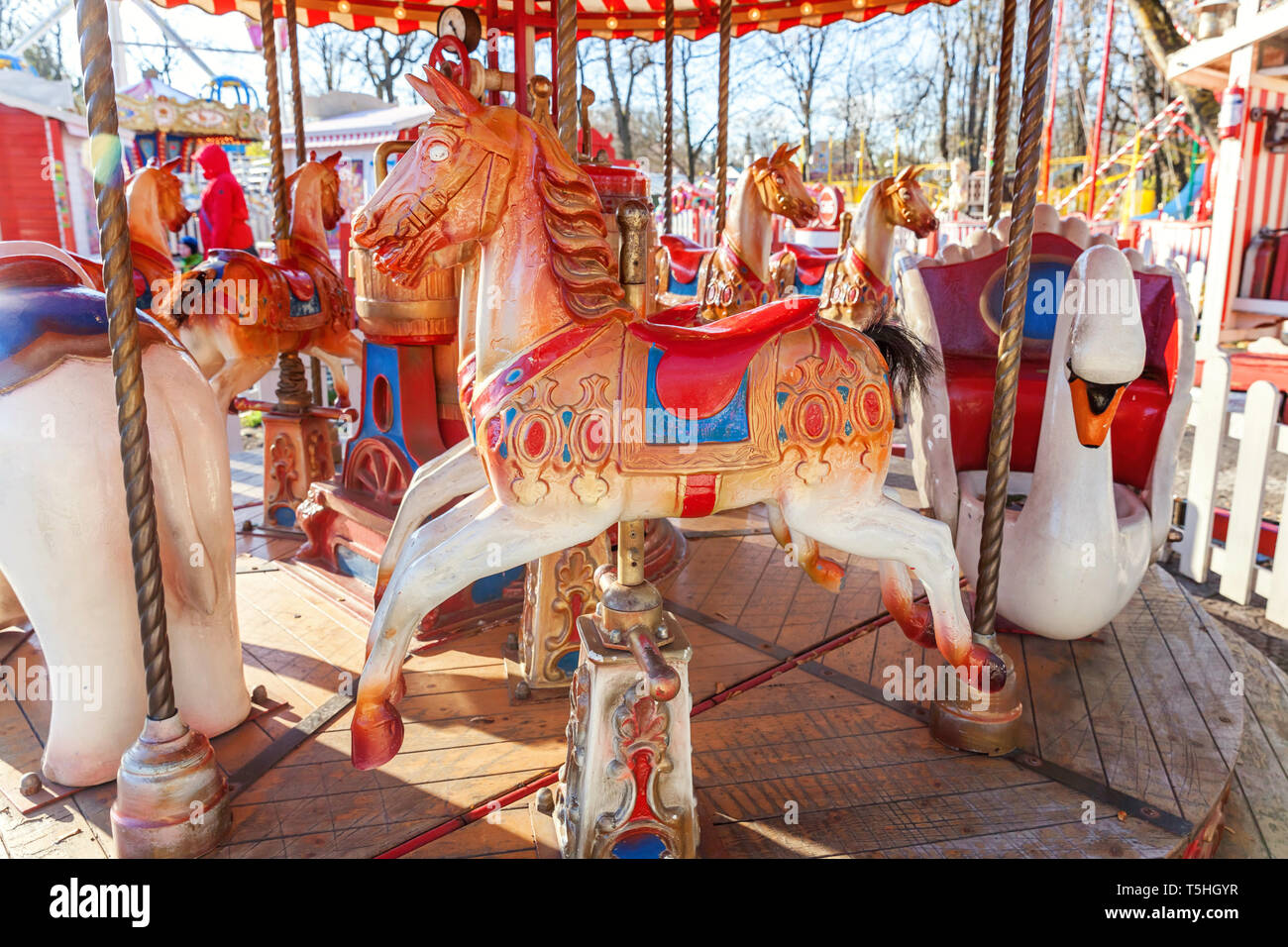 Children outdoor colourful vintage Merry-Go-Round flying horse carousel ...