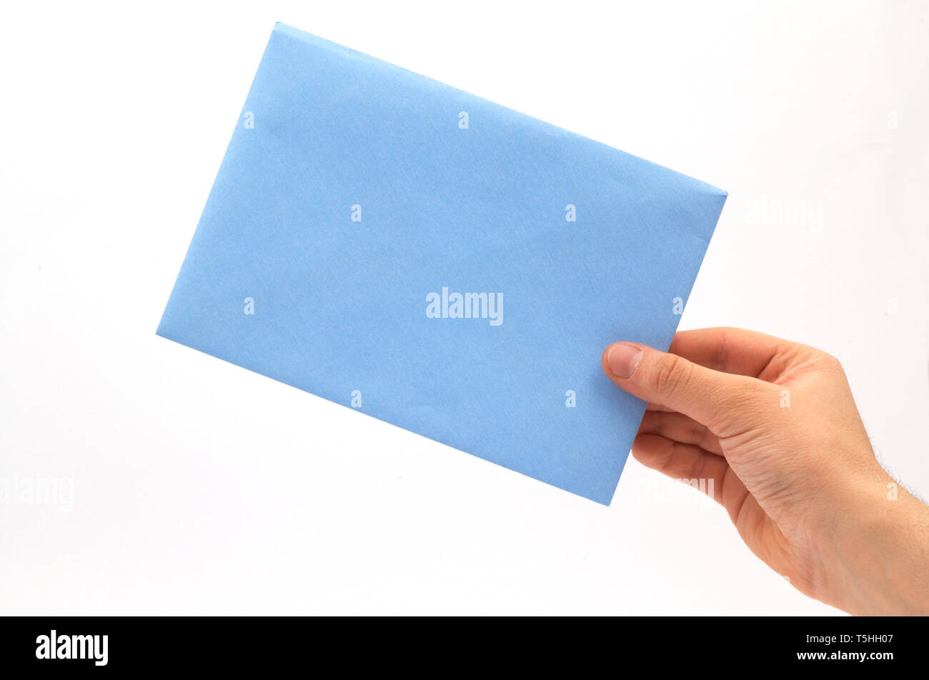 blue envelope in hand on white Stock Photo - Alamy