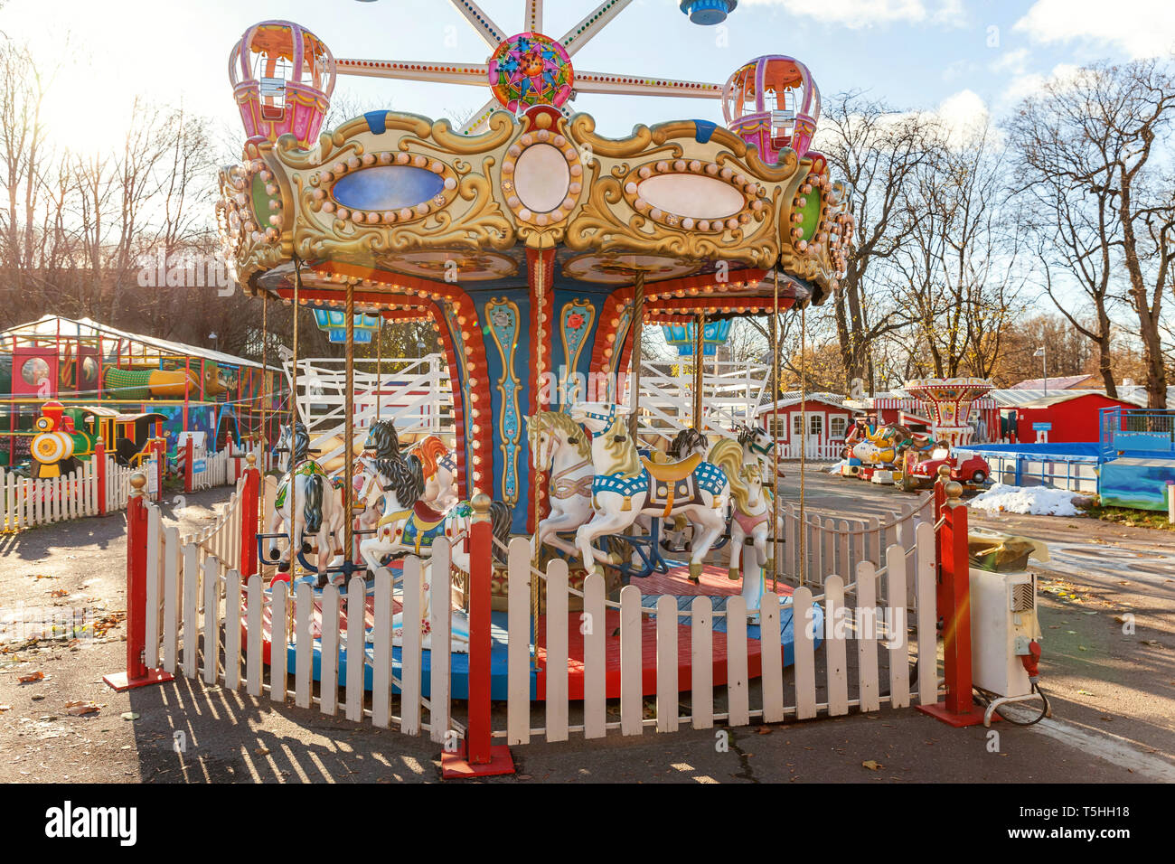 Children outdoor colourful vintage Merry-Go-Round flying horse carousel ...