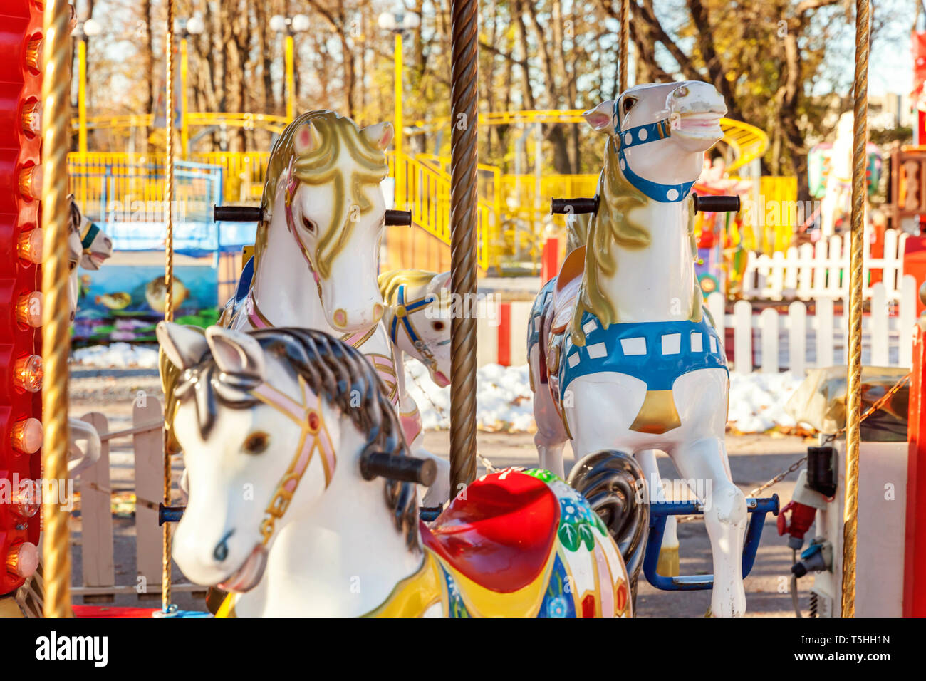 Children outdoor colourful vintage Merry-Go-Round flying horse carousel ...