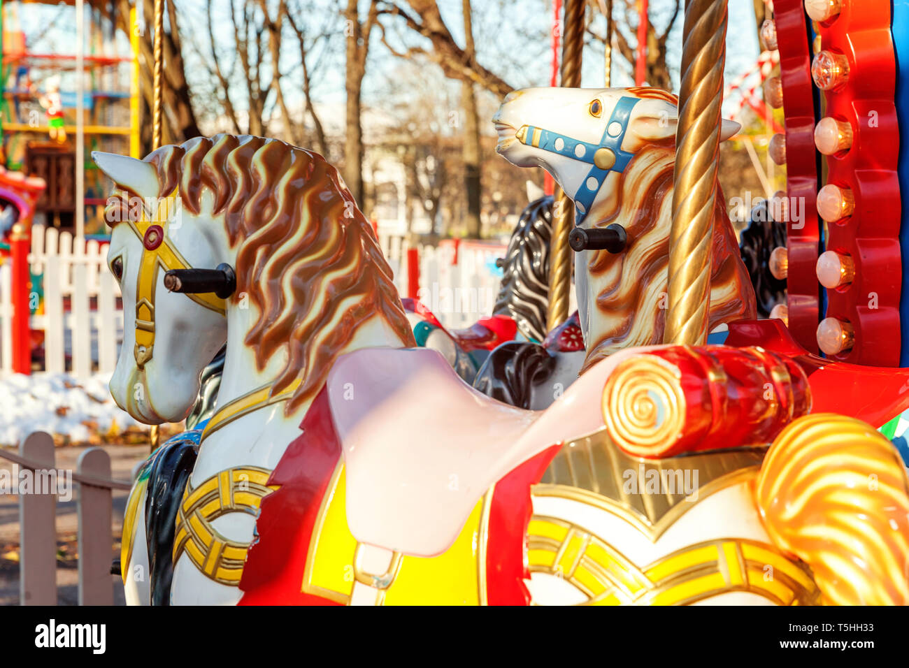 Children outdoor colourful vintage Merry-Go-Round flying horse carousel ...