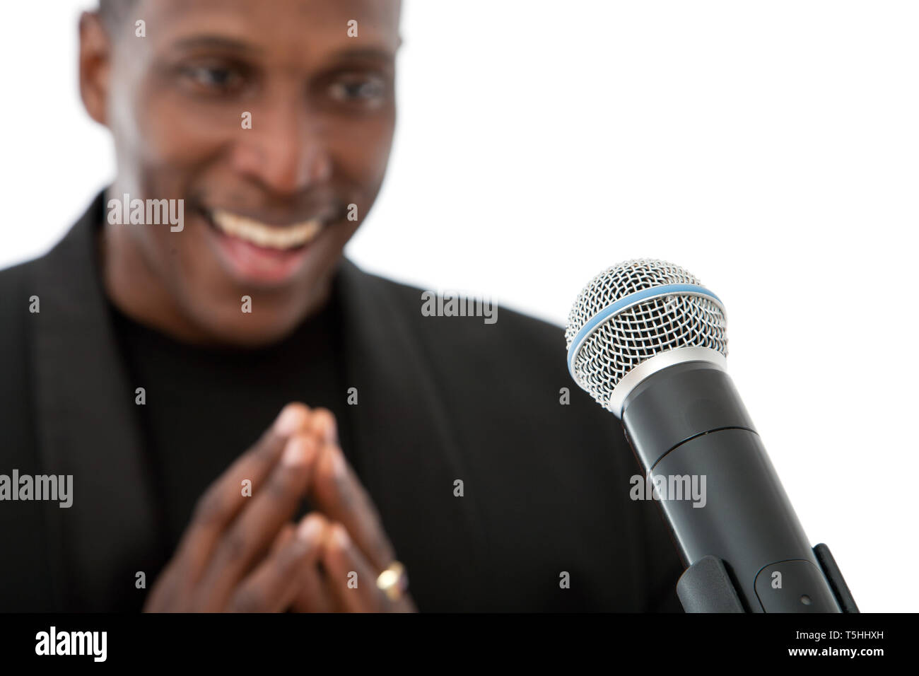 African American singer standing on a white background Stock Photo - Alamy