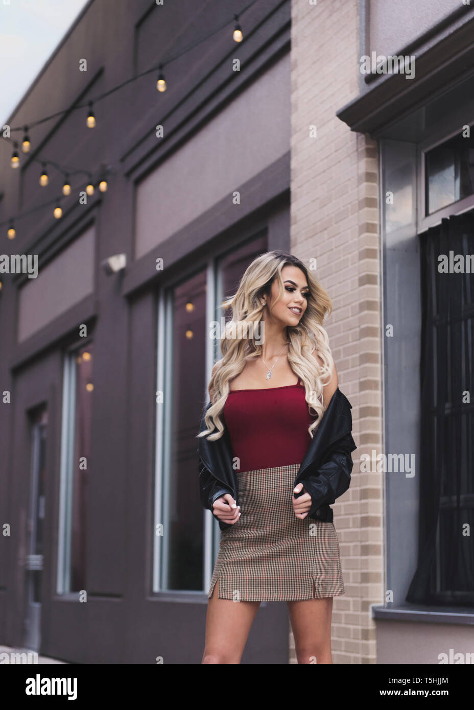 Pretty girl dancing in the streets Stock Photo - Alamy
