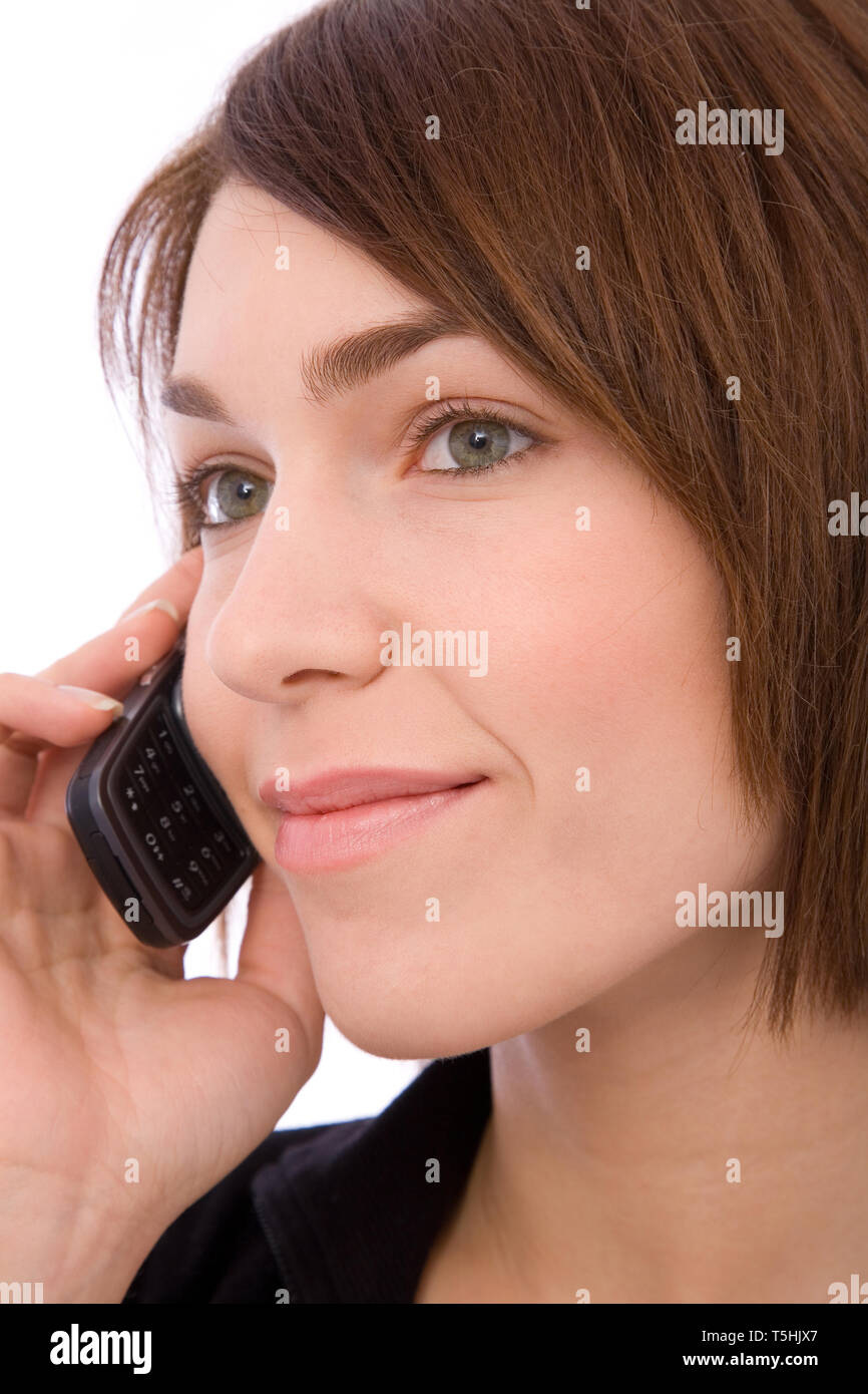 beautiful woman talking with her cell phone on white Stock Photo - Alamy