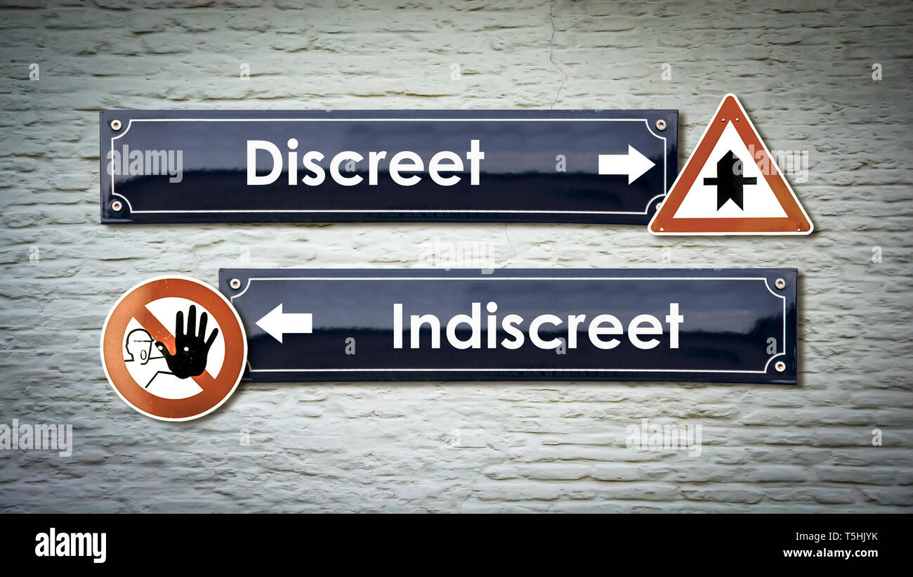 Wall Sign Discreet versus Indiscreet Stock Photo - Alamy