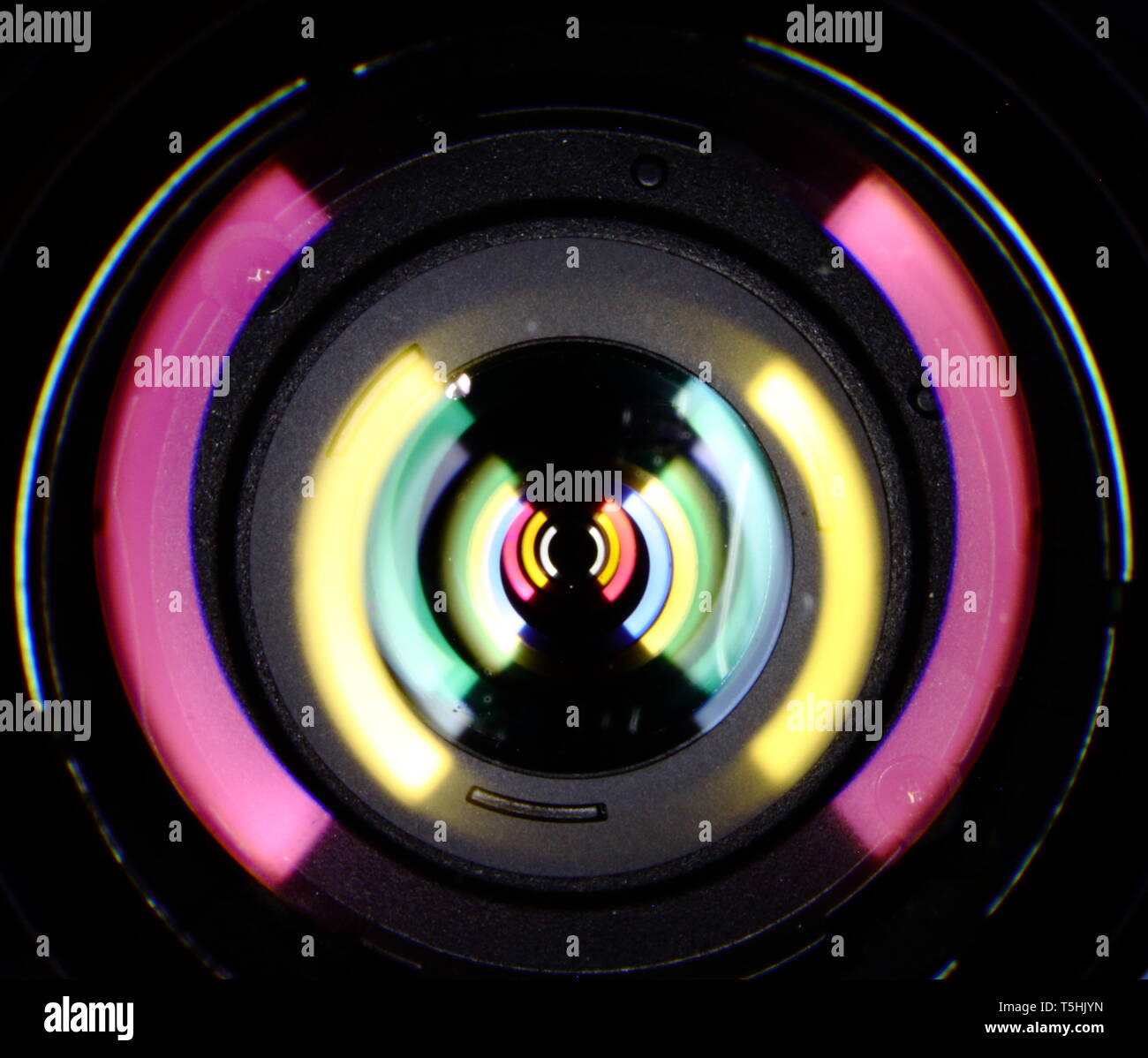 Abstract shot of lights refracted through a lens by placing a torch at ...