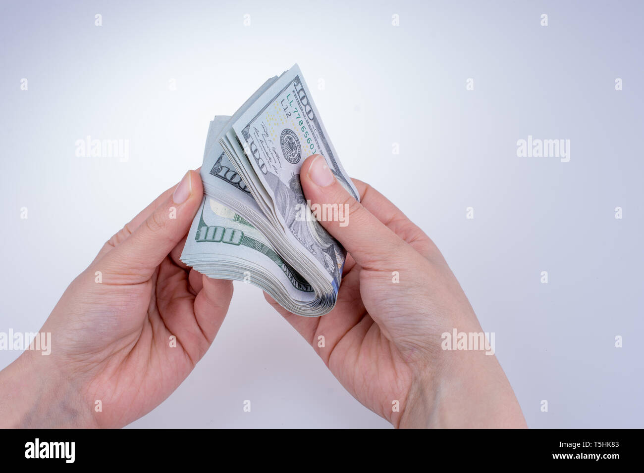 Human hand holding American dollar bill as money isolated on white ...