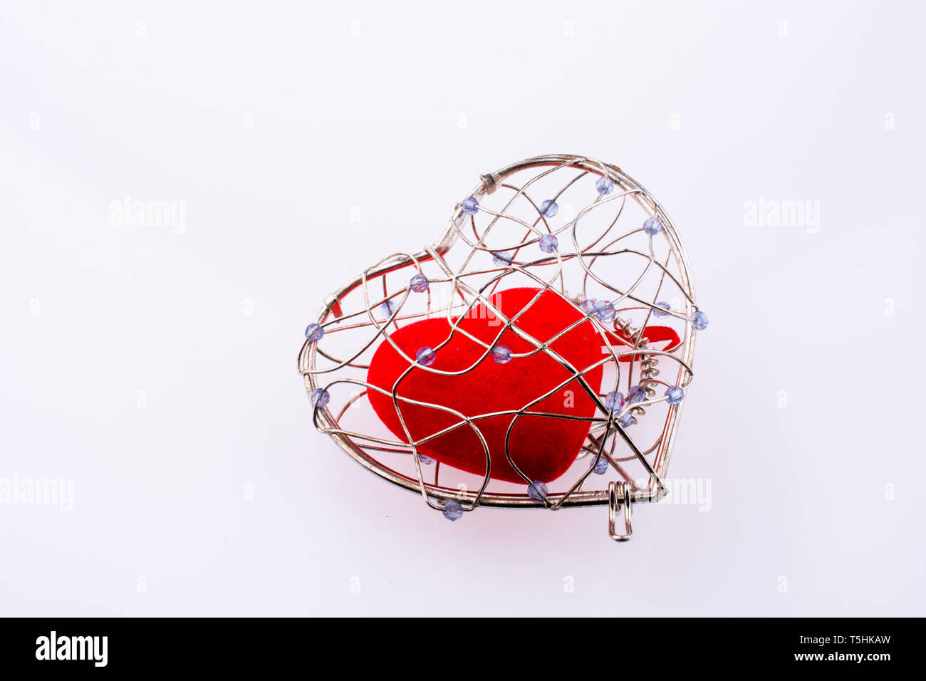 Red heart in a heart shaped cage Stock Photo - Alamy