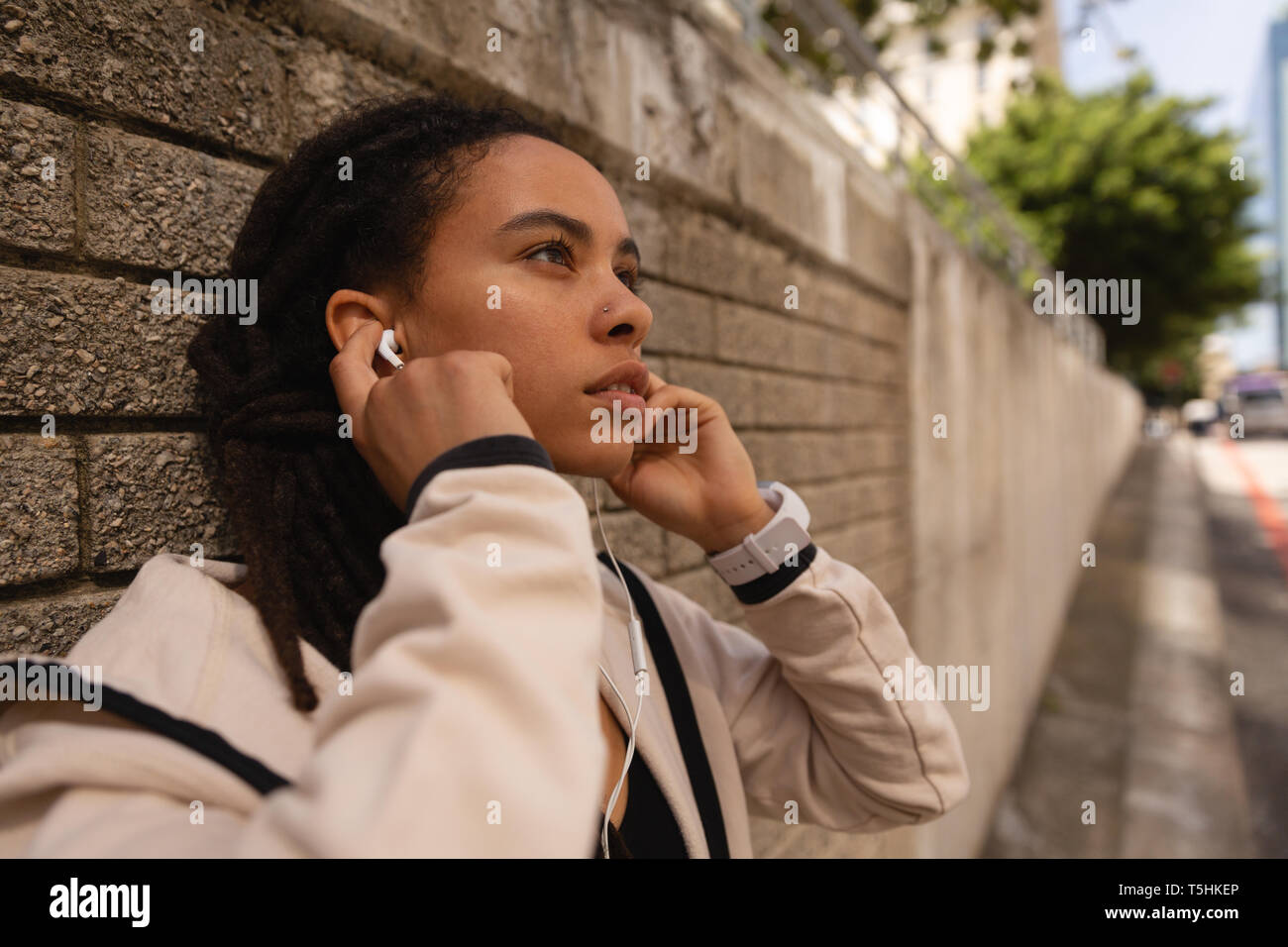 Women leaning against wall on hi-res stock photography and images - Alamy