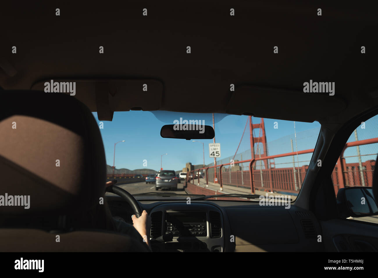 Woman driving car over golden gate bridge Stock Photo - Alamy