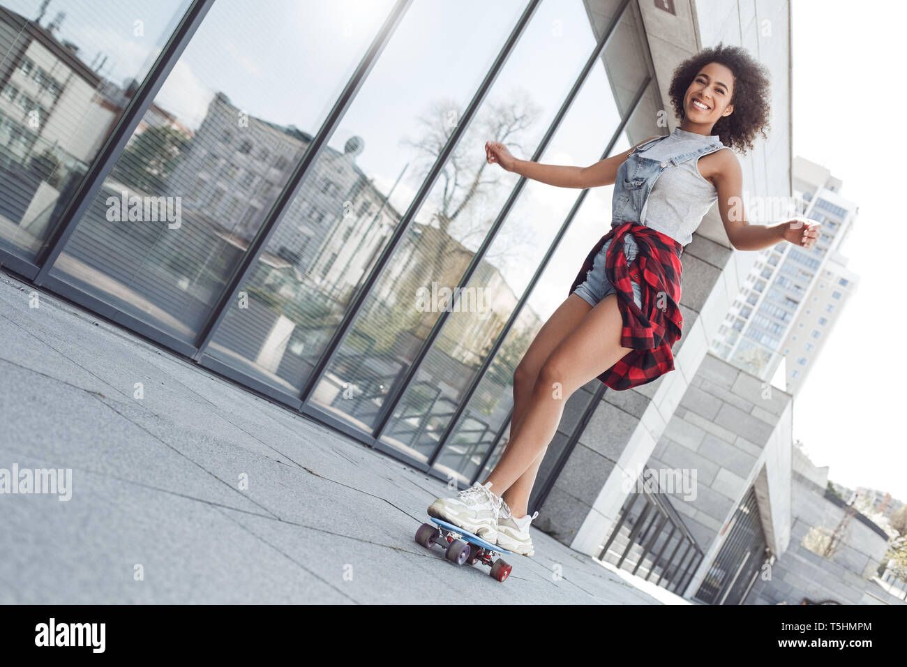 Riding penny board hi-res stock photography and images - Alamy