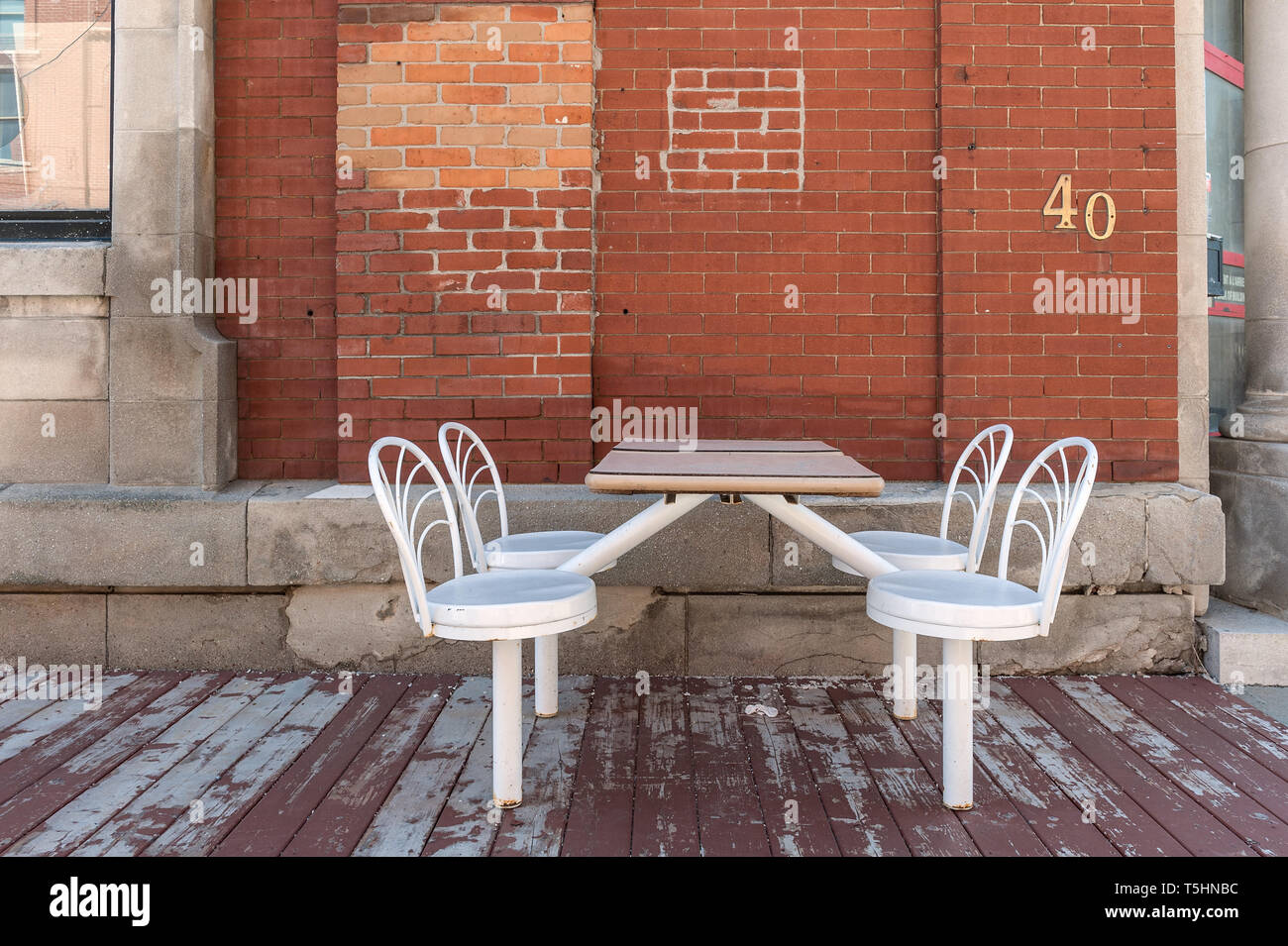 White chairs and table on wooden platform Stock Photo - Alamy