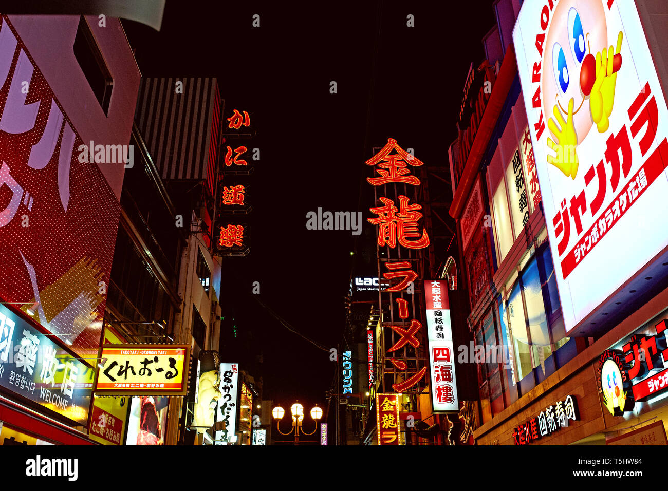 Neon illuminated signs and billboards of Dotonbori street at night in ...
