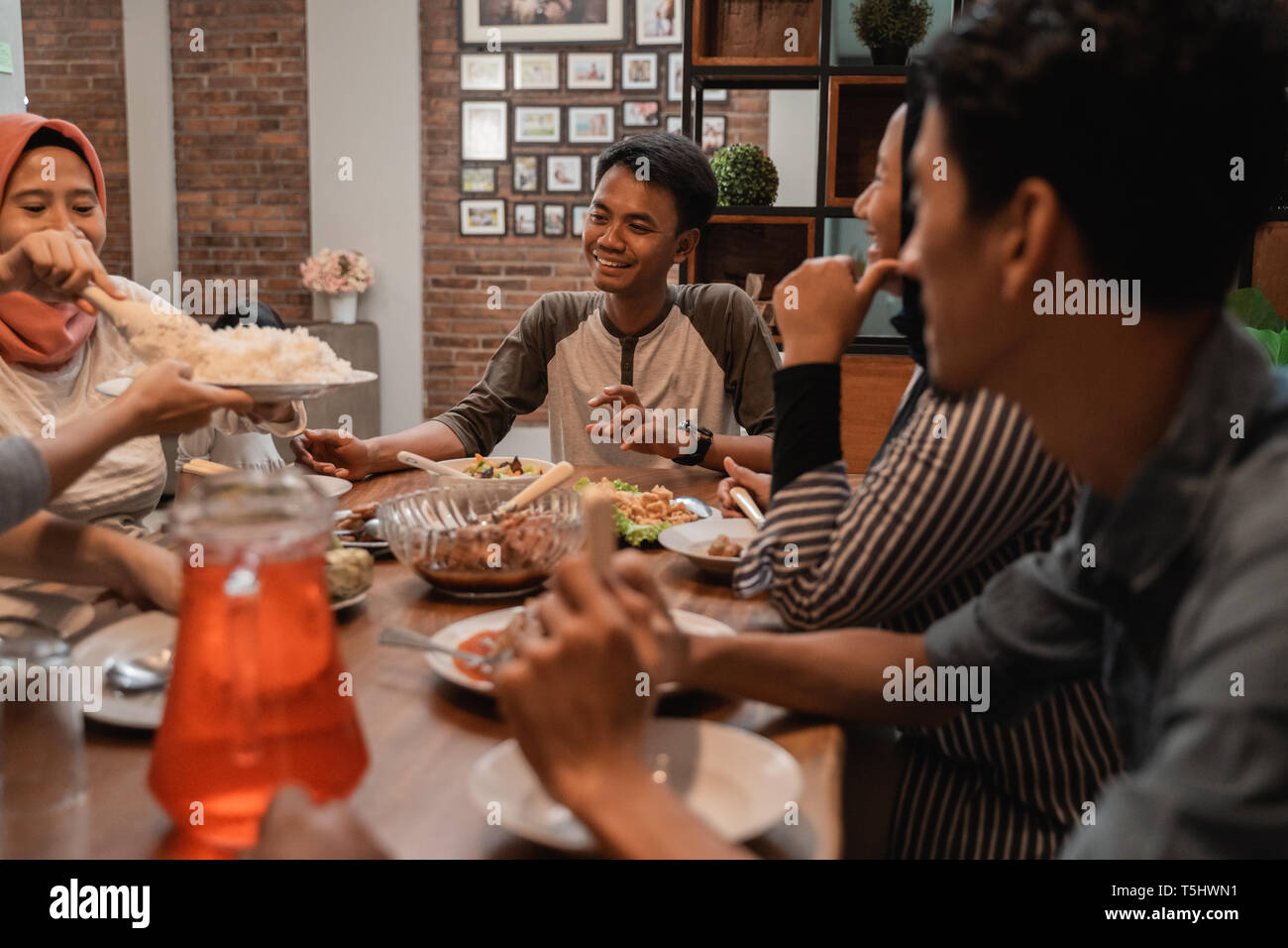 asian muslim family dinner together. break fasting Stock Photo - Alamy