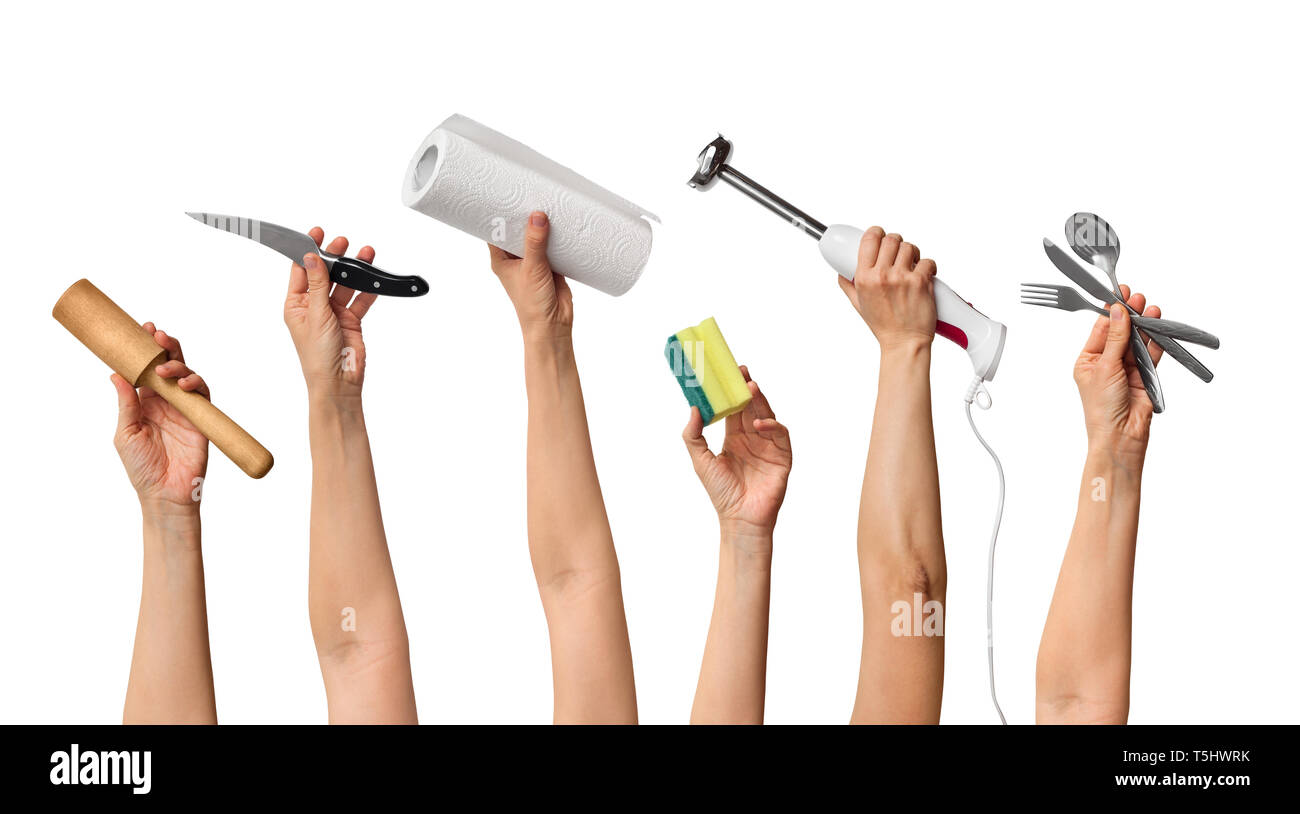 set of the different kitchen equipment in hands, on white background ...