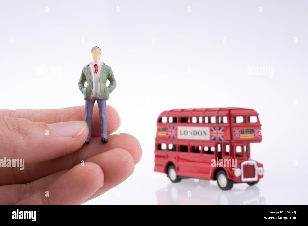 Human figure near a London Bus on a white background Stock Photo - Alamy