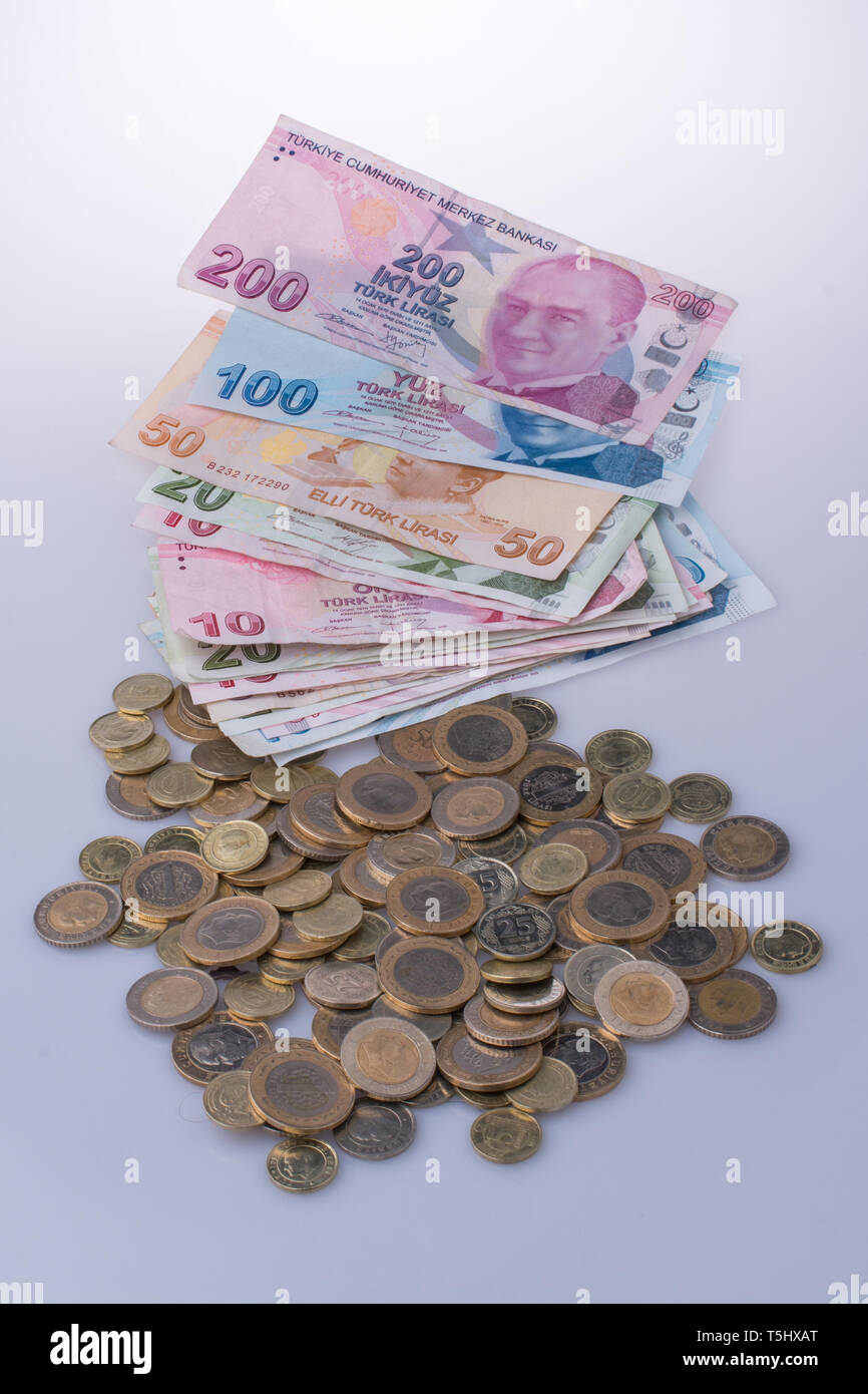 Turkish Lira coins and banknotes side by side on white background Stock ...