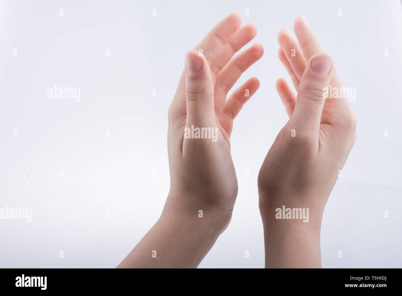 Hand holding on a white background Stock Photo - Alamy