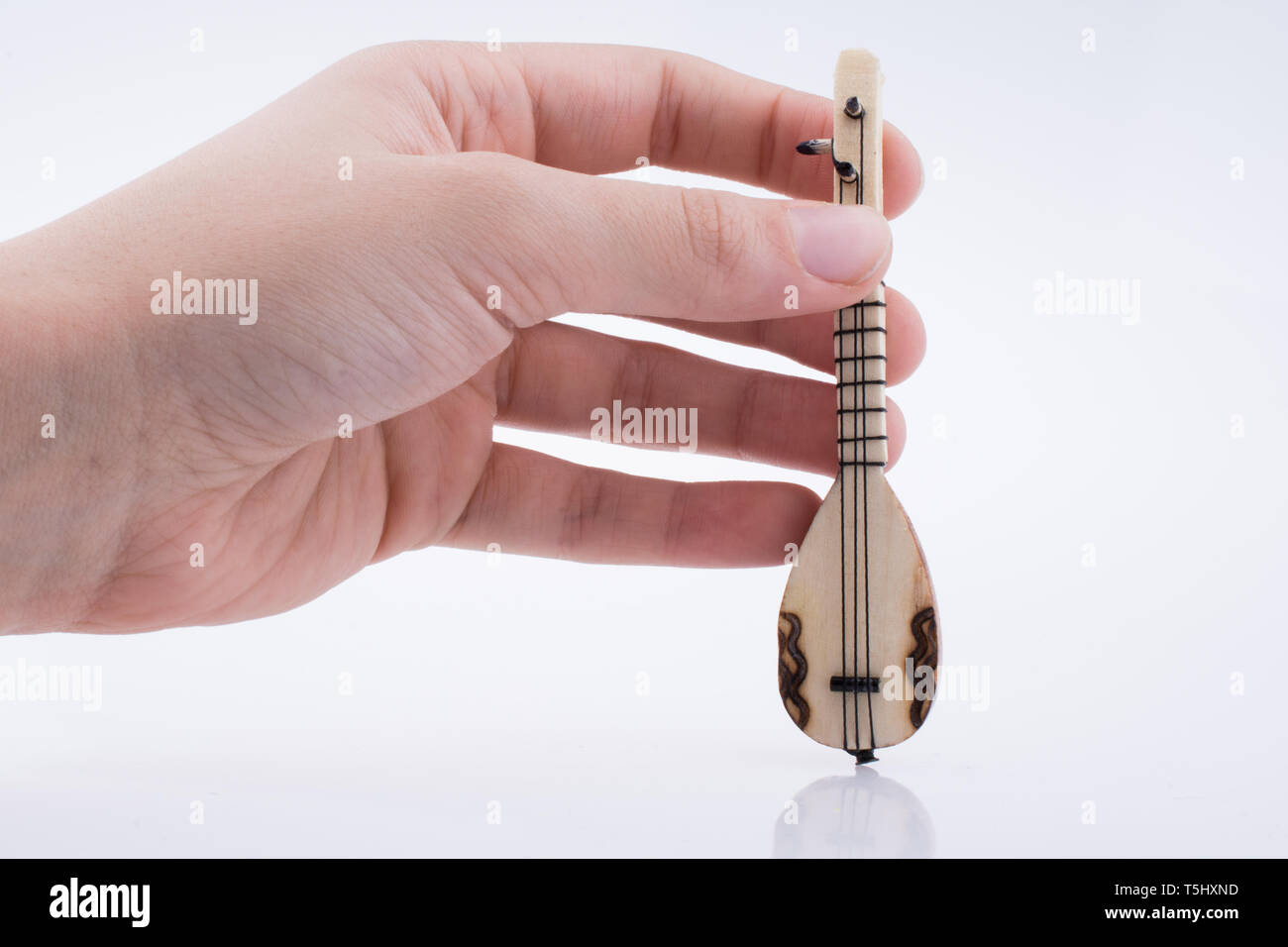 Hand holding turkish musical instrument saz on a white background Stock ...