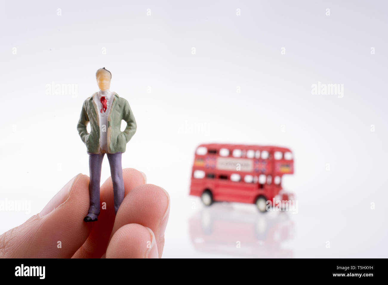 Human figure near a London Bus on a white background Stock Photo - Alamy