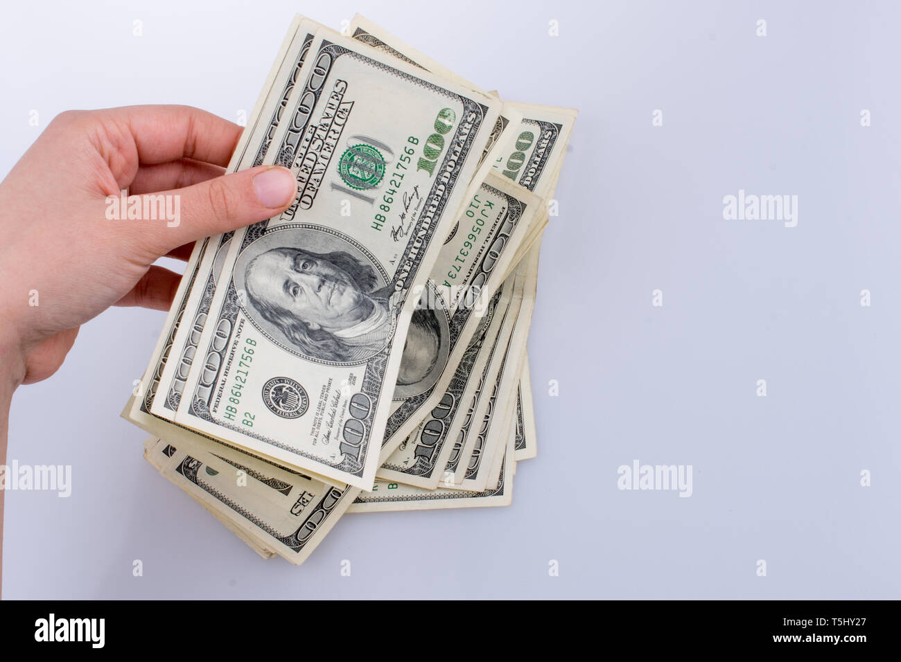 Human hand holding American dollar bill as money isolated on white ...