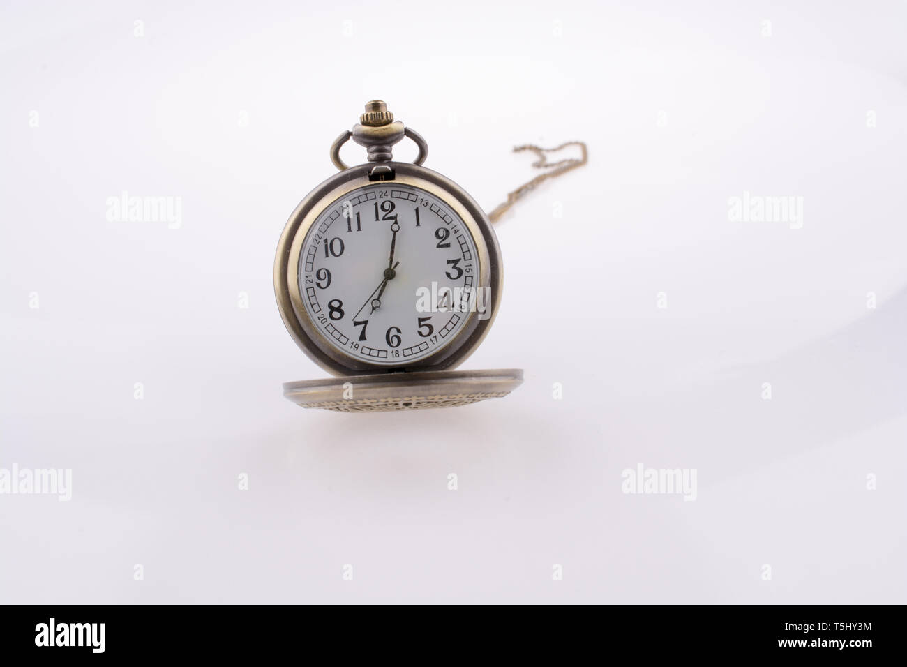 Retro style pocket watch on white background Stock Photo - Alamy