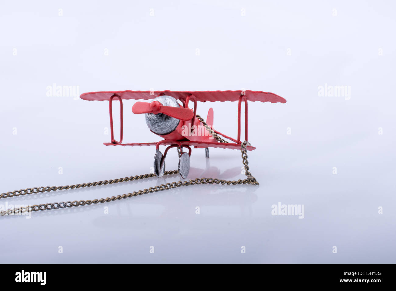 Little metal model airplane on white ground Stock Photo - Alamy