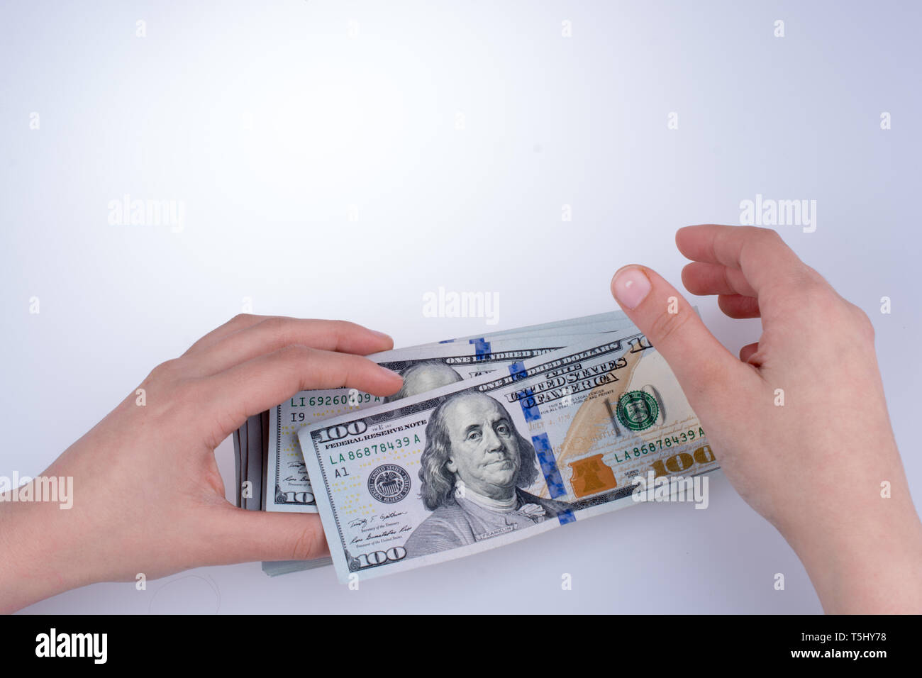 Human hand holding American dollar bill as money isolated on white ...
